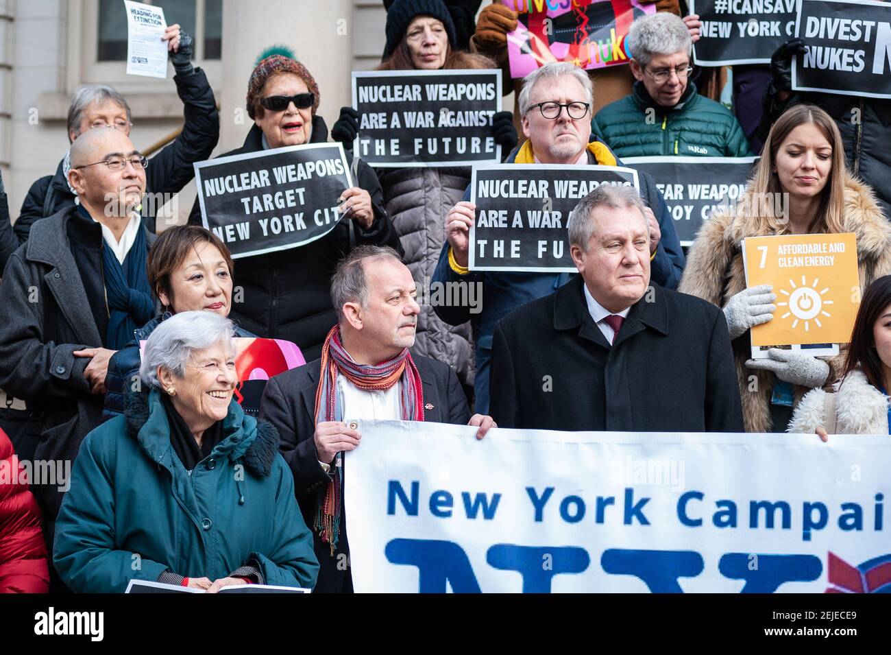 Activists rally at a press conference calling for the divestment from ...