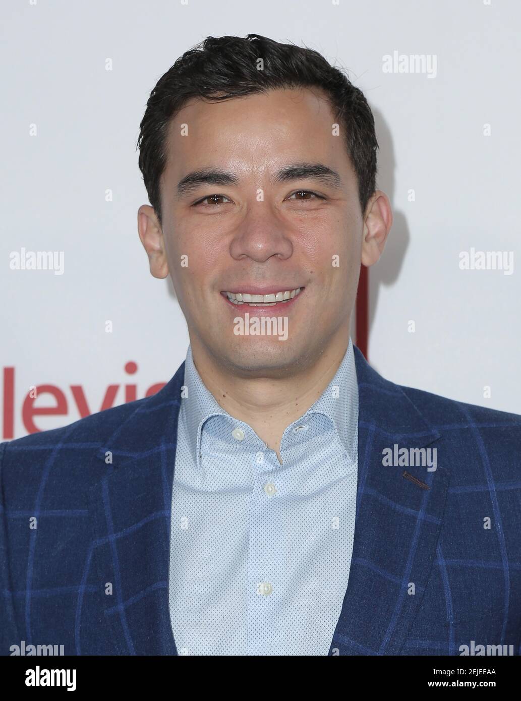 Conrad Ricamora walking the red carpet at the Television Academy's 25th ...
