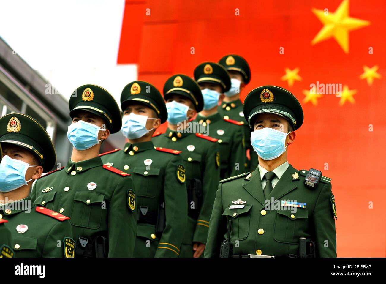 Chinese paramilitary policemen wearing face masks for prevention of the ...