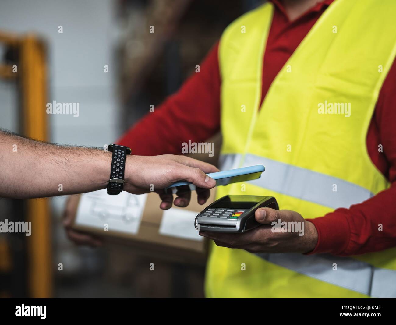 Close up customer making a payment with mobile smartphone inside ...