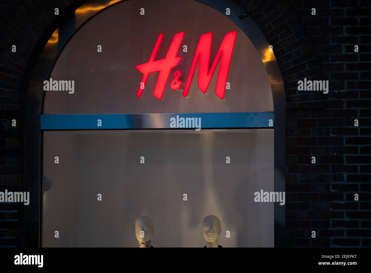 A generaly view of an H&M logo as seen in a display window in a ...