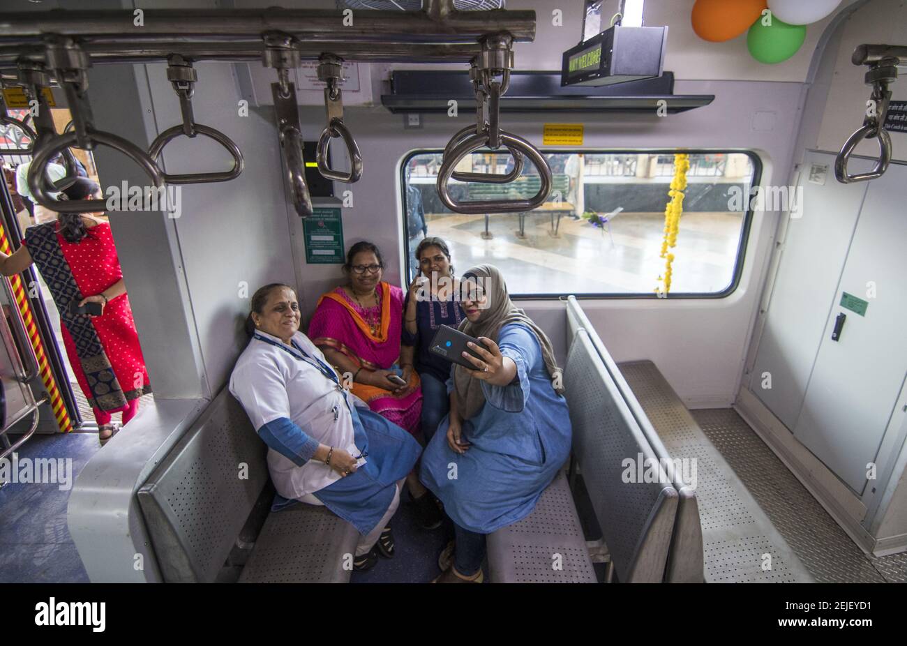 MUMBAI, INDIA - JANUARY 30: People travel in Central Railway's first air-conditioned EMU local ...