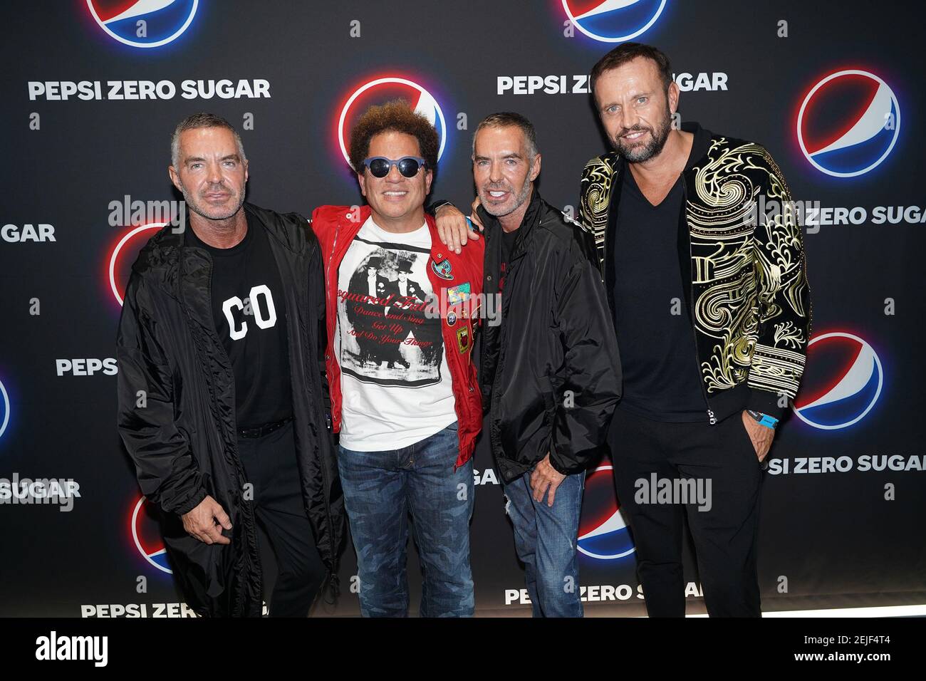 MIAMI, FLORIDA - JANUARY 31: Second from left Romero Britto and last ...