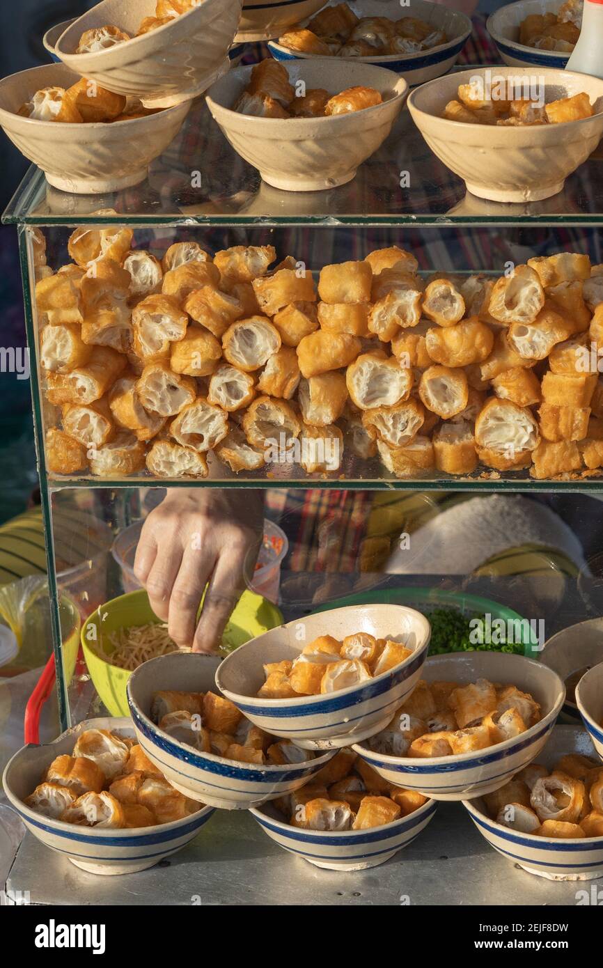 Many fried bread dough - youtiao at at breakfast stall Stock Photo - Alamy
