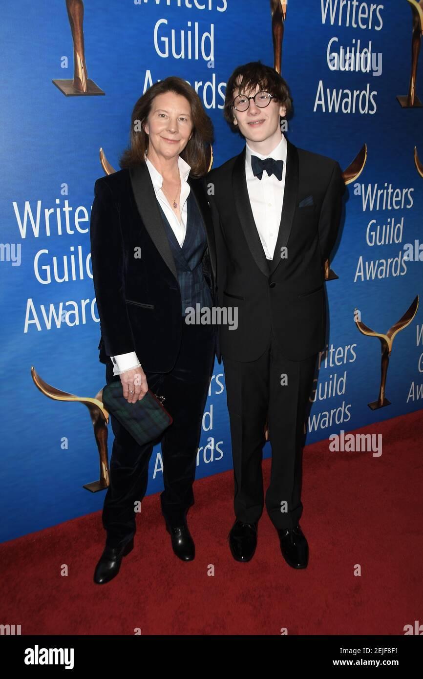 Courtenay Miles and guest walks the carpet at the 2020 Writers Guild ...