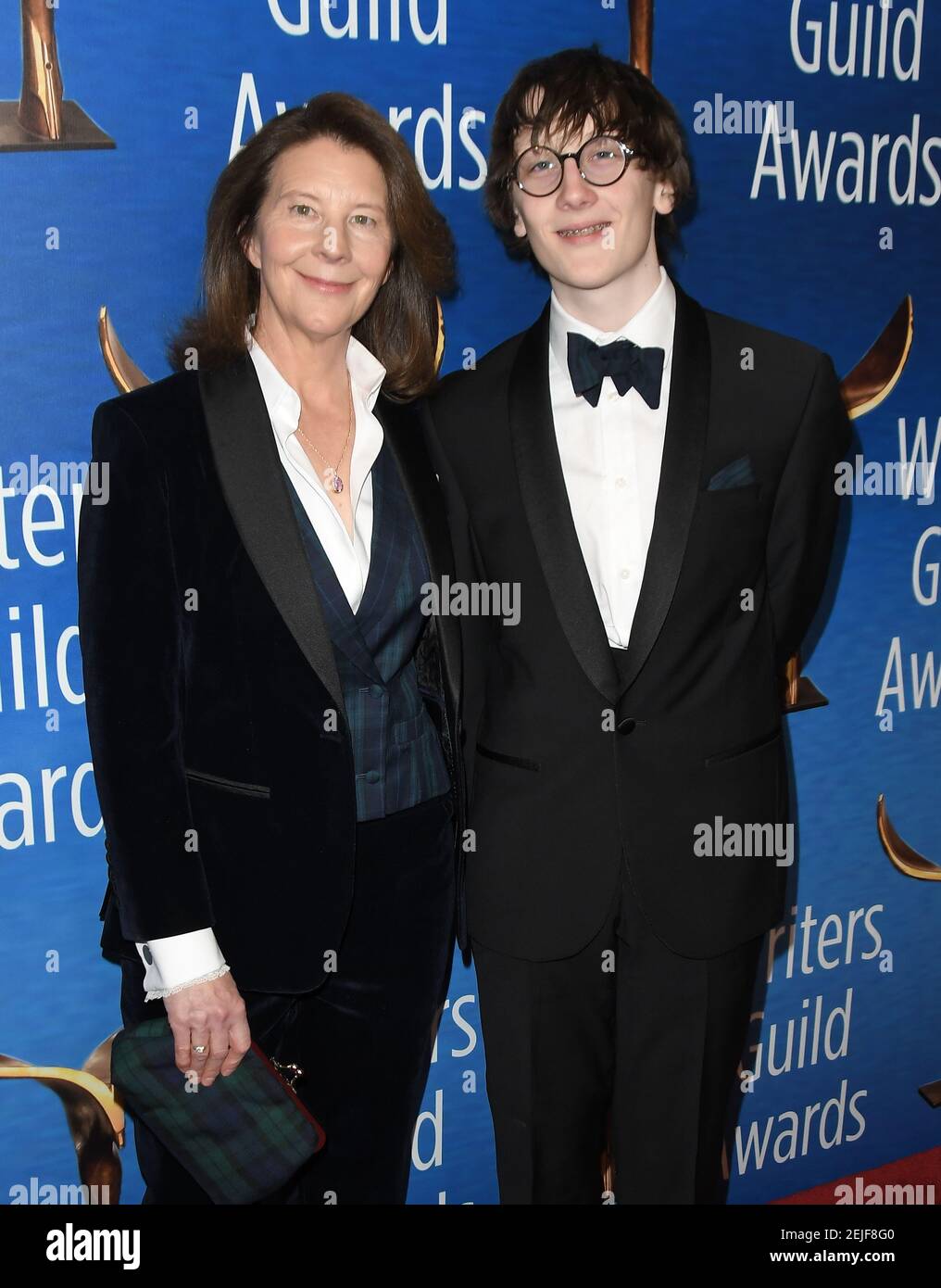 Courtenay Miles and guest walks the carpet at the 2020 Writers Guild ...