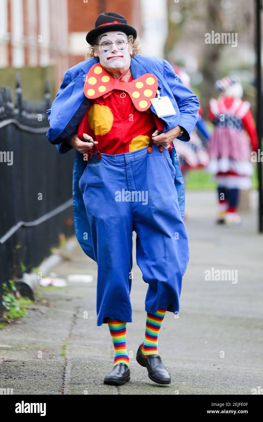 A clown dressed in full costume arrives for the annual Grimaldi Clown ...