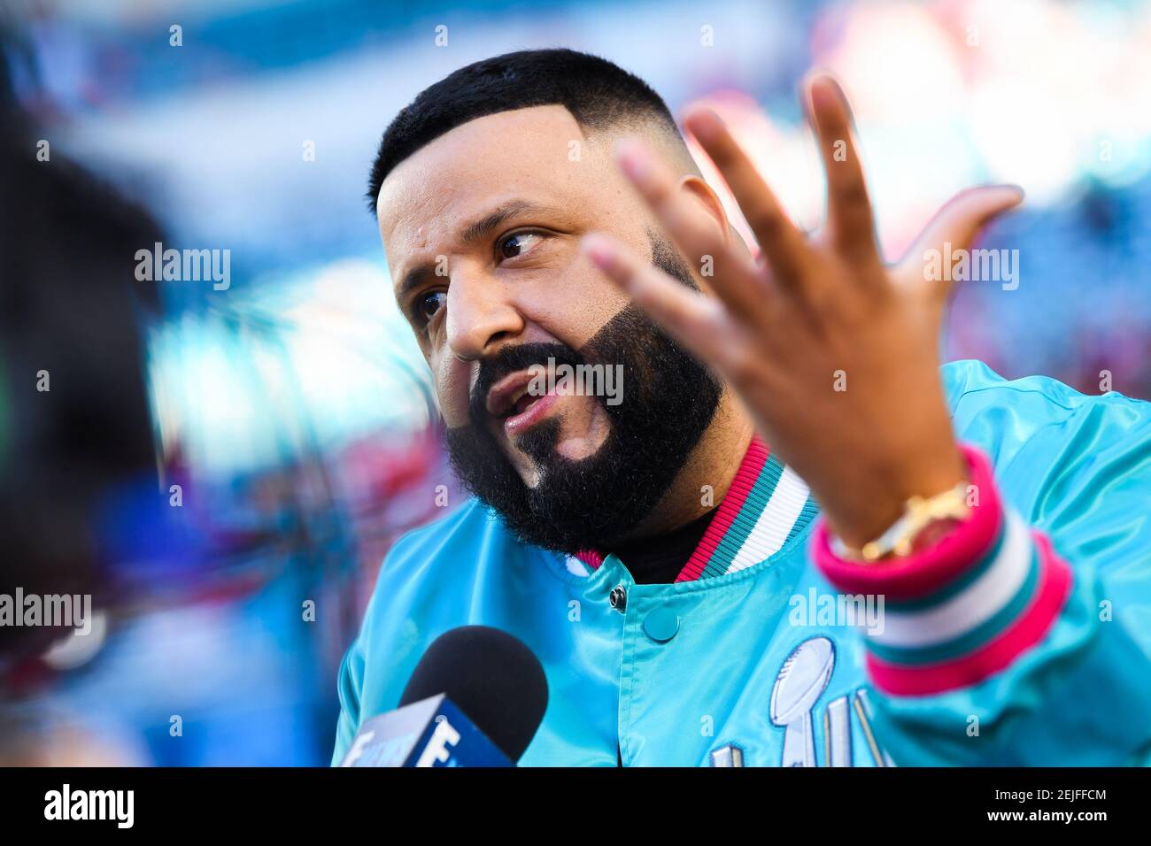 DJ Khaled talks on the field before Super Bowl LIV between the San ...
