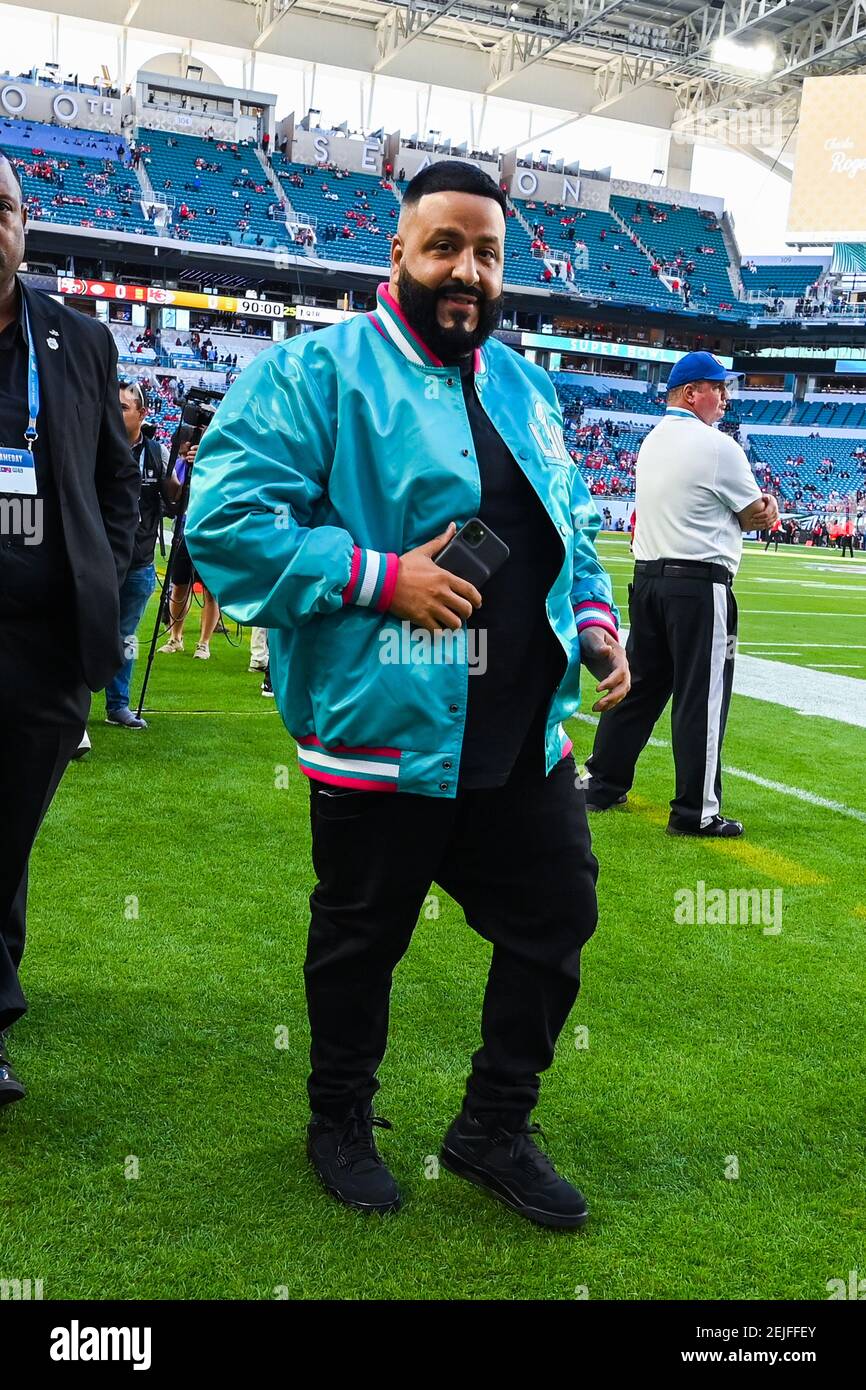 DJ Khaled walks on the field before Super Bowl LIV between the San ...