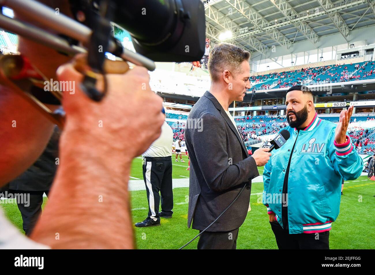 DJ Khaled talks on the field before Super Bowl LIV between the San ...