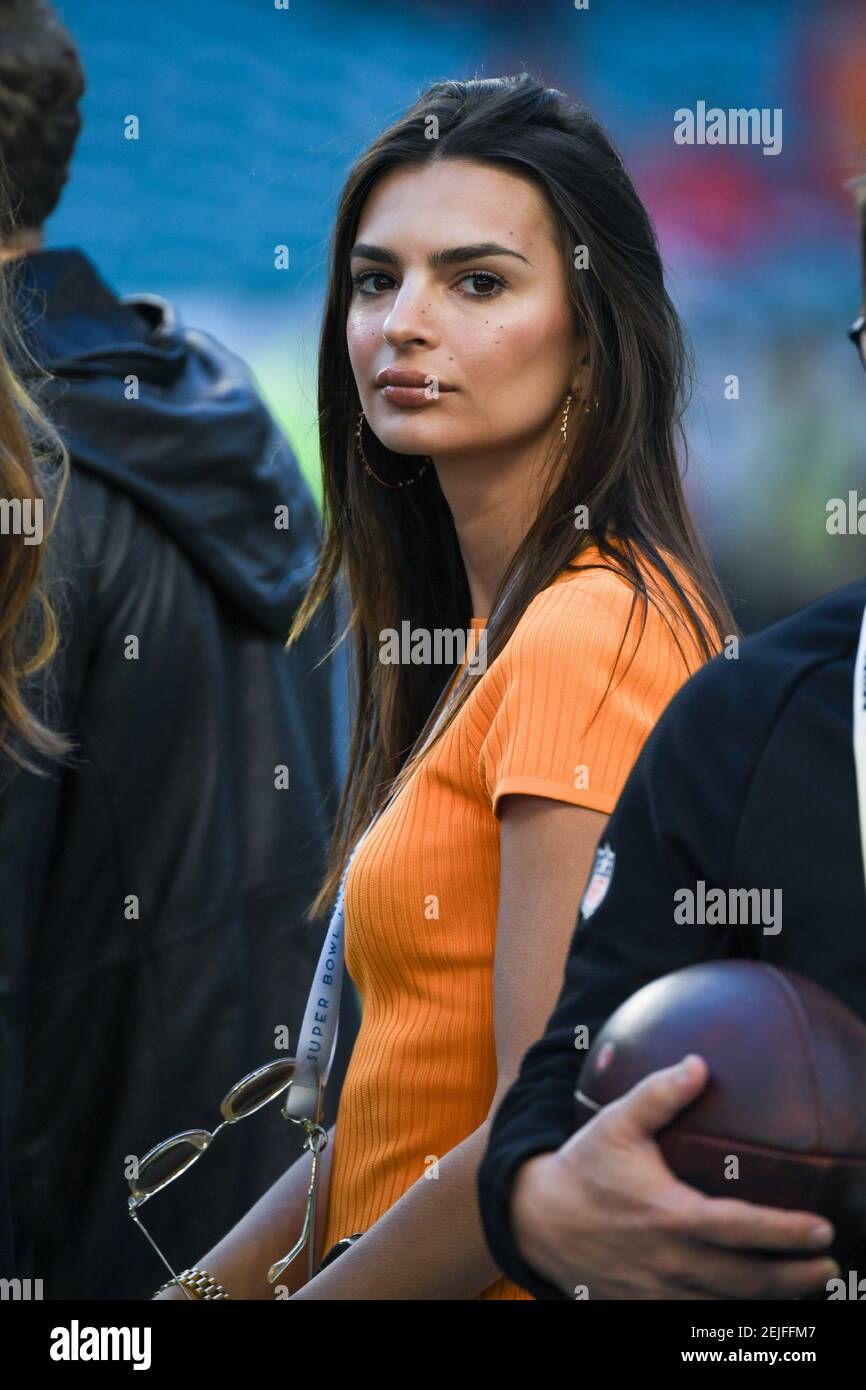 Emily Ratajkowski stands on the field before Super Bowl LIV between the ...