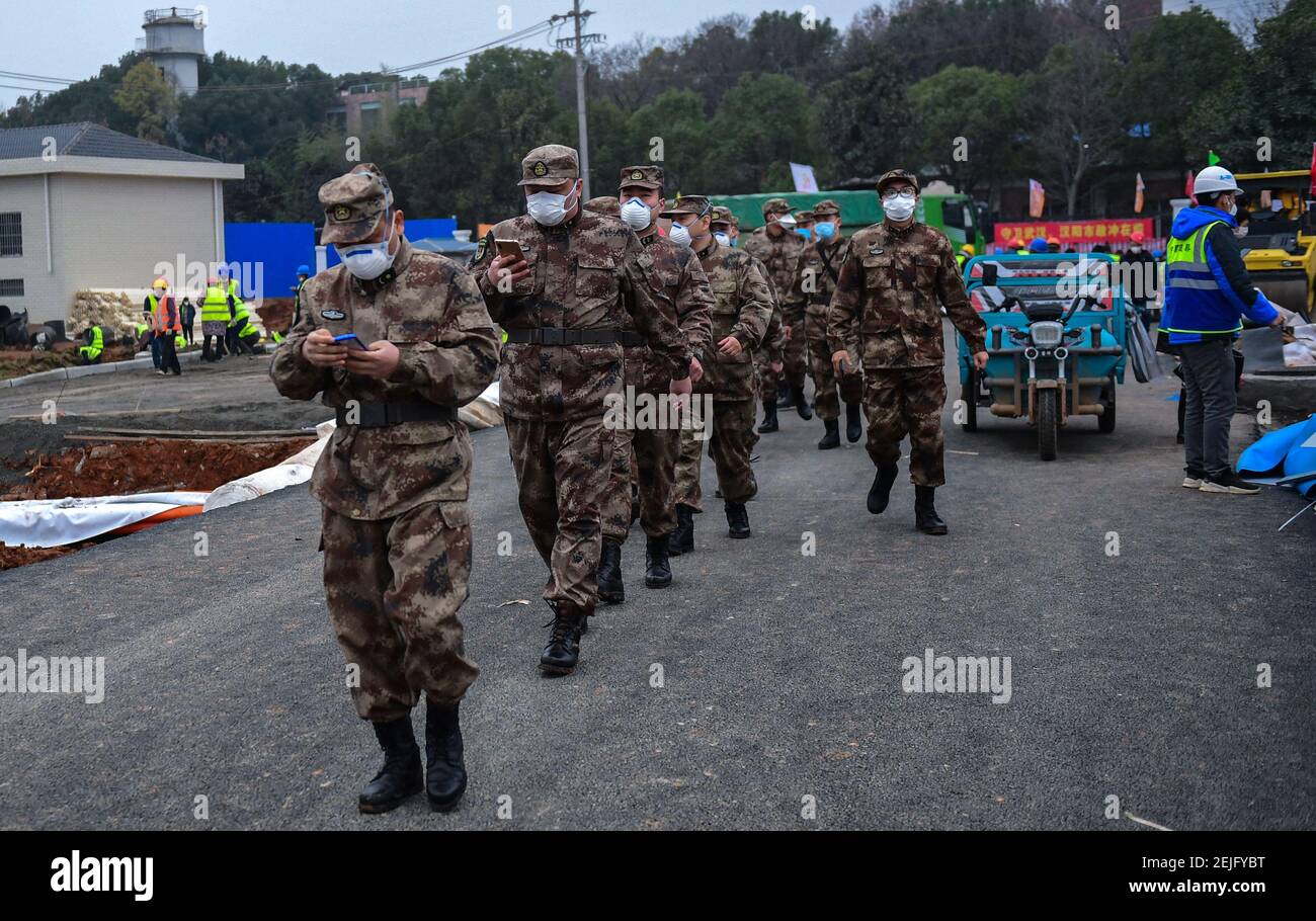 Chinese soldiers inspect the construction site of Huo Shen Shan ...