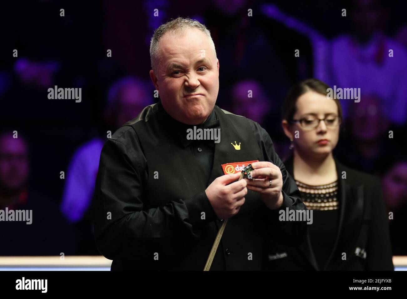 John Higgins of England considers a shot to Barry Hawkins of England at ...