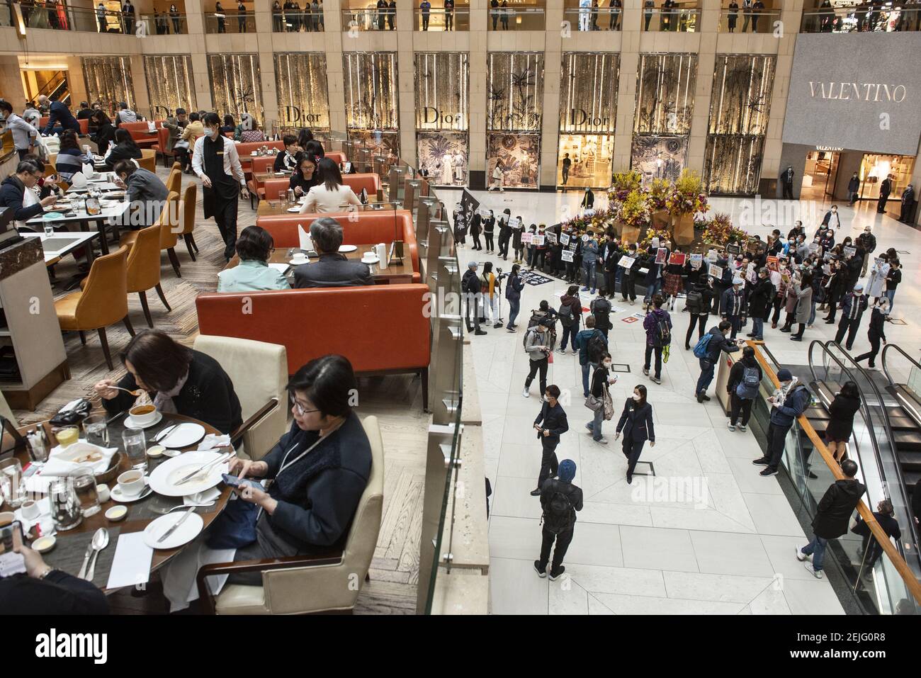 People eat at a restaurant during the protest. Dozens of demonstrators ...