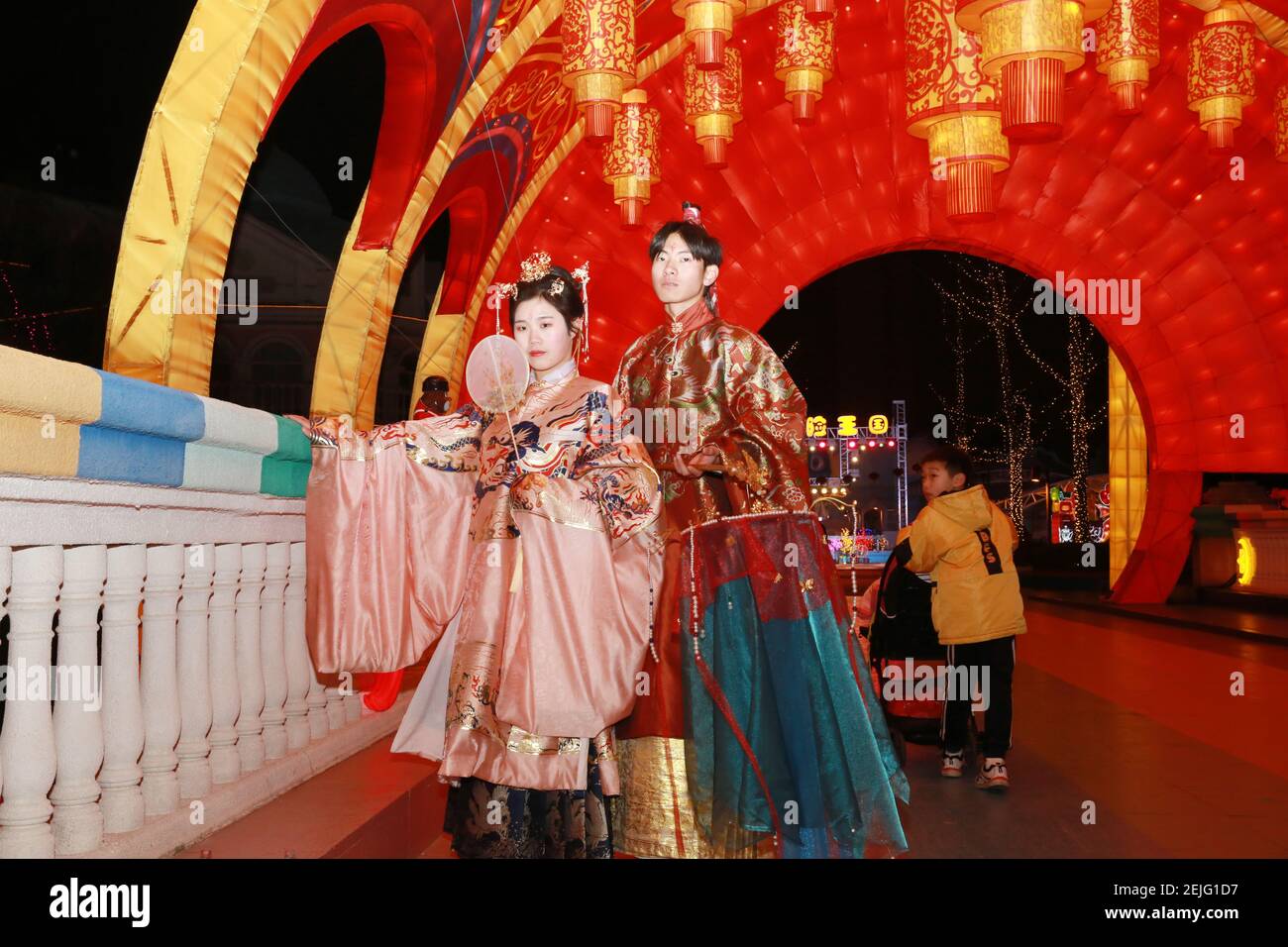 Tourists dressed in traditional Chinese clothes enjoy the grand Spring ...