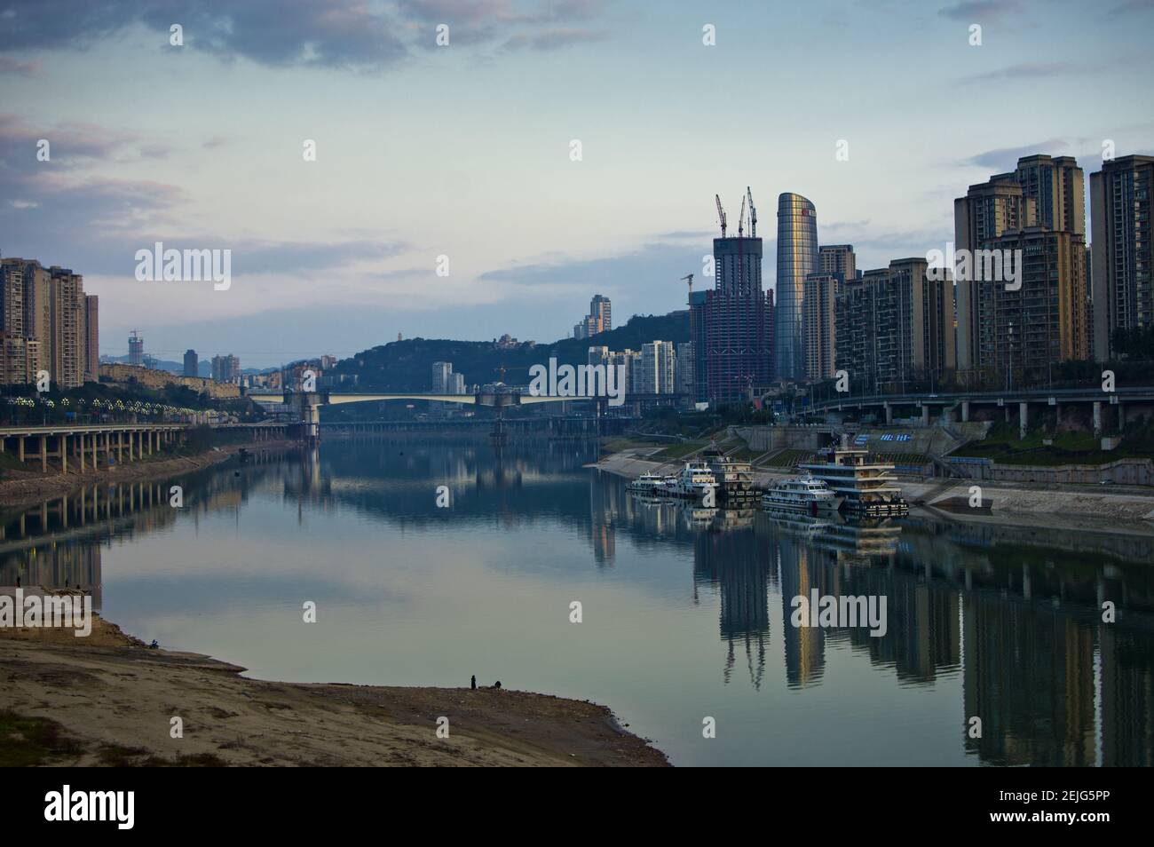 Strolling along the riverbank, a picture of the river, skyline and sky ...