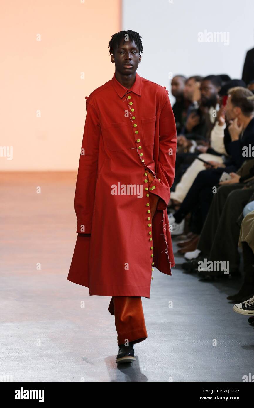 Model walks on the runway at the Kenneth Nicholson fashion show during ...