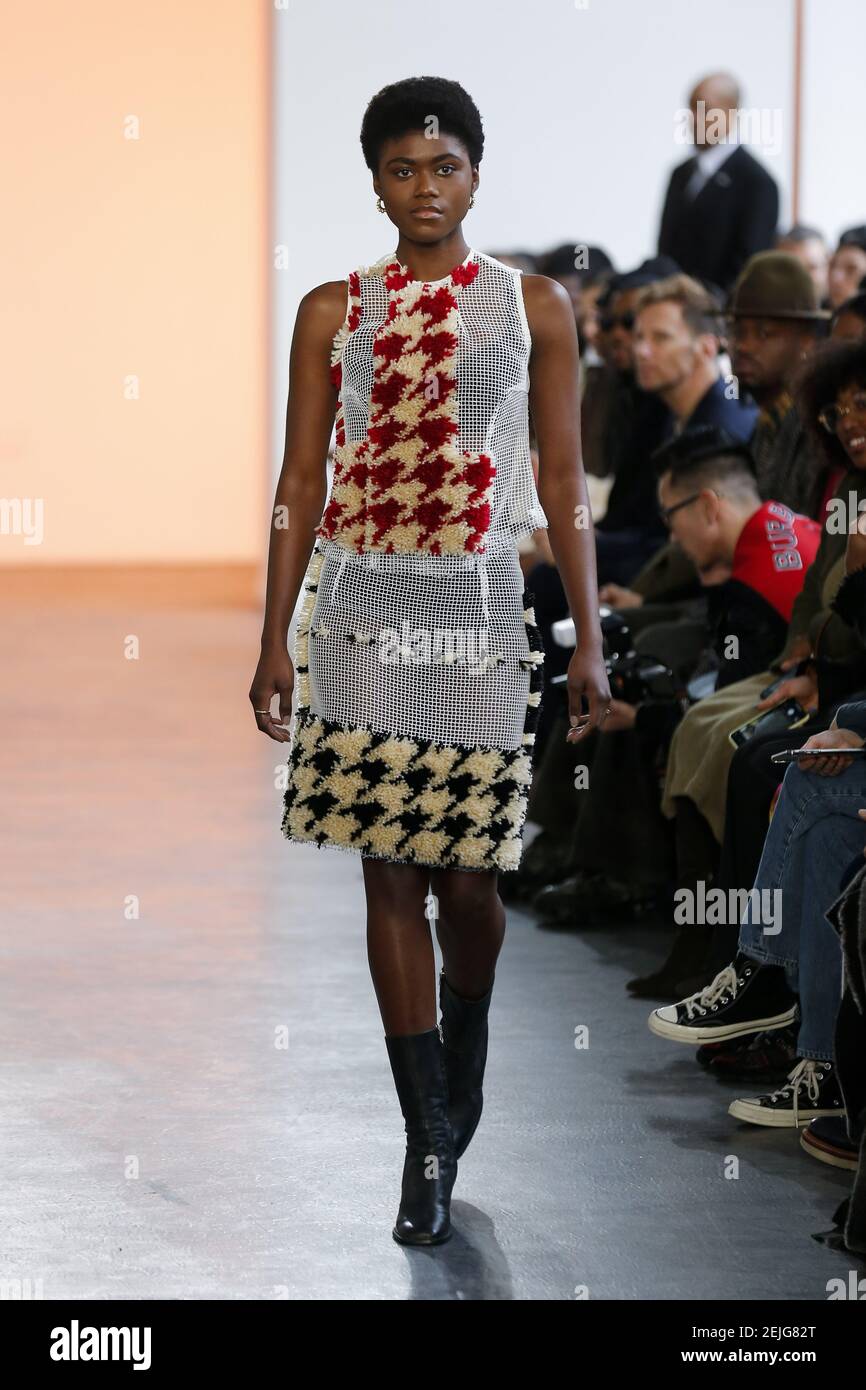 Model walks on the runway at the Kenneth Nicholson fashion show during ...