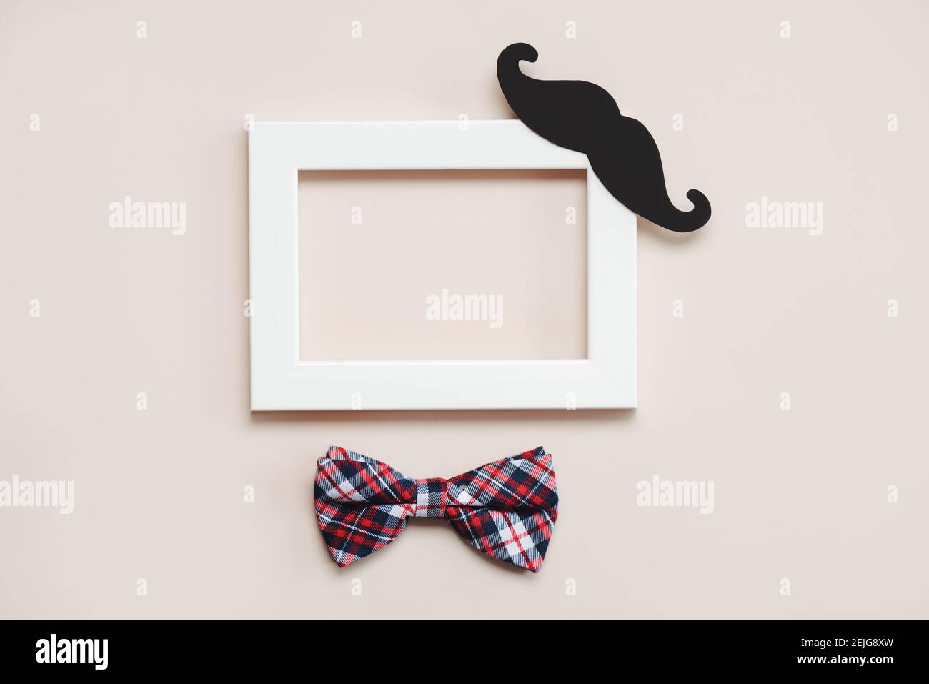 Happy Father's Day.White frame with bow tie and false mustache on a ...