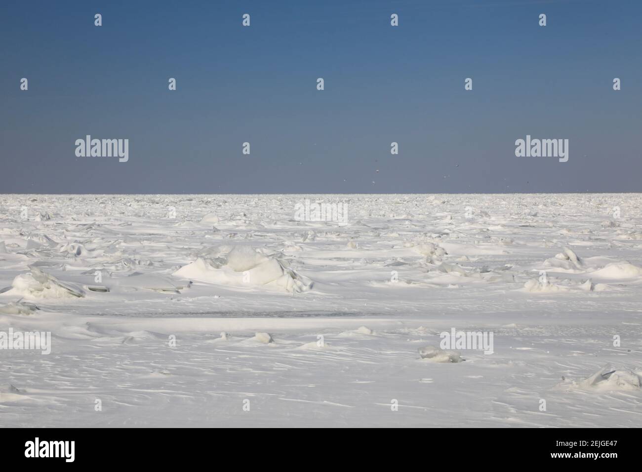 Flat frozen lake surface Stock Photo - Alamy