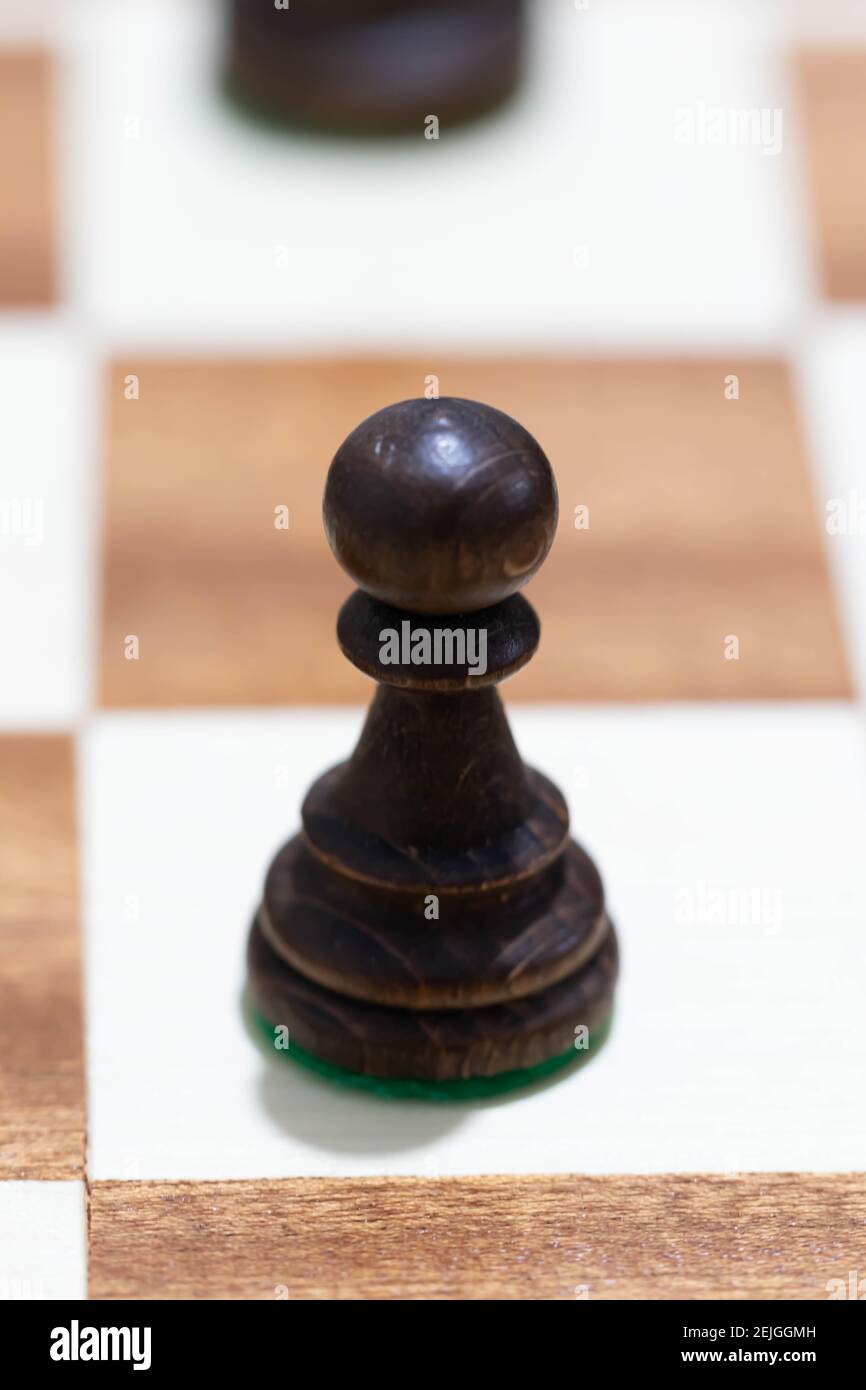 Playing wooden chess on a chessboard. Tactics and strategy. Black and white shapes Stock Photo ...