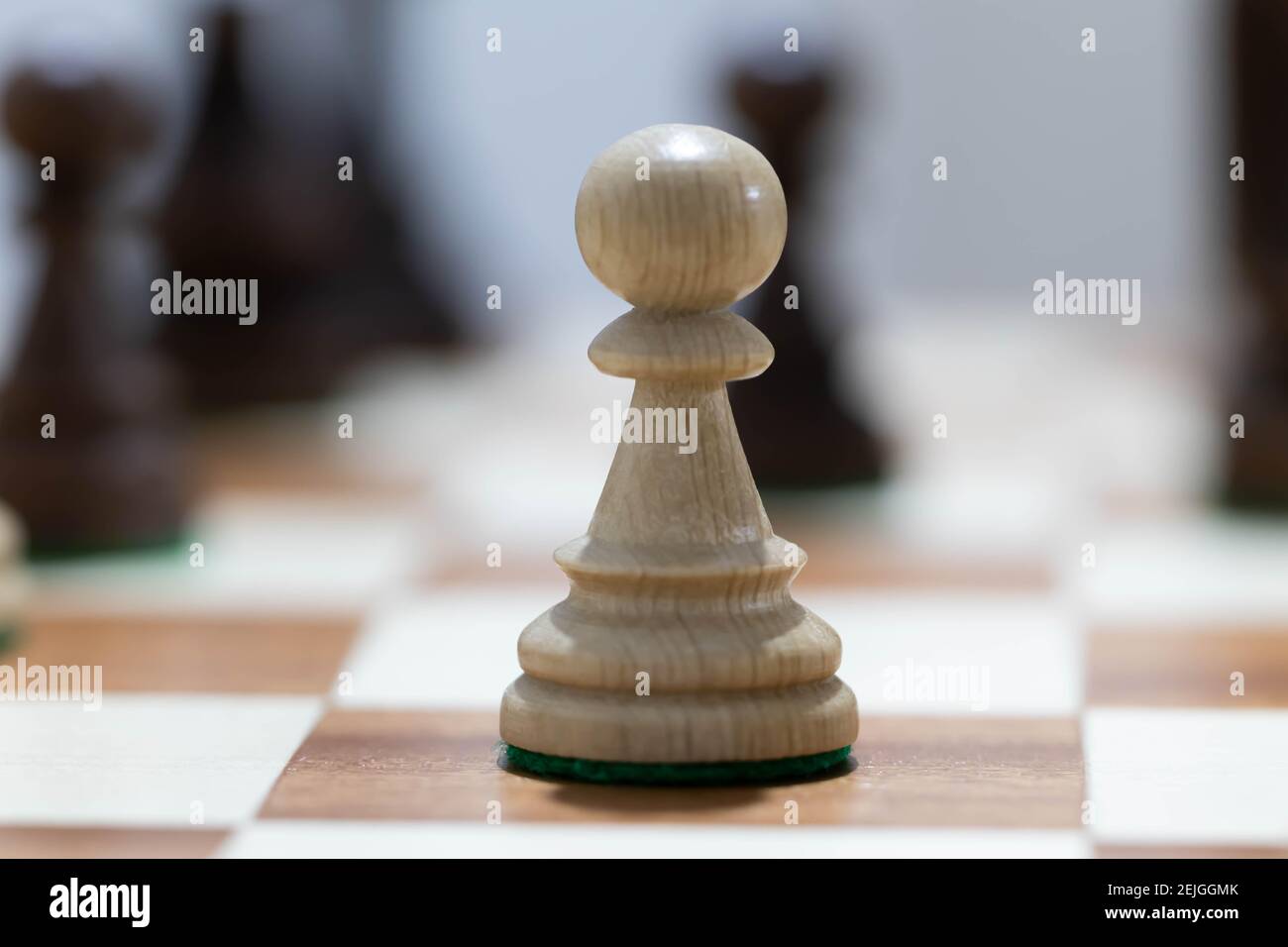 Playing wooden chess on a chessboard. Tactics and strategy. Black and white shapes Stock Photo ...
