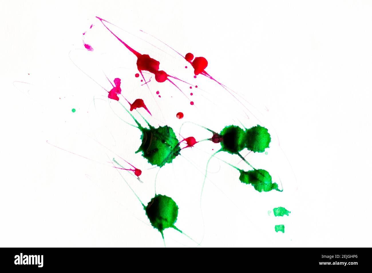 Ink drops on the paper, red, green and blue ink splashes background ...
