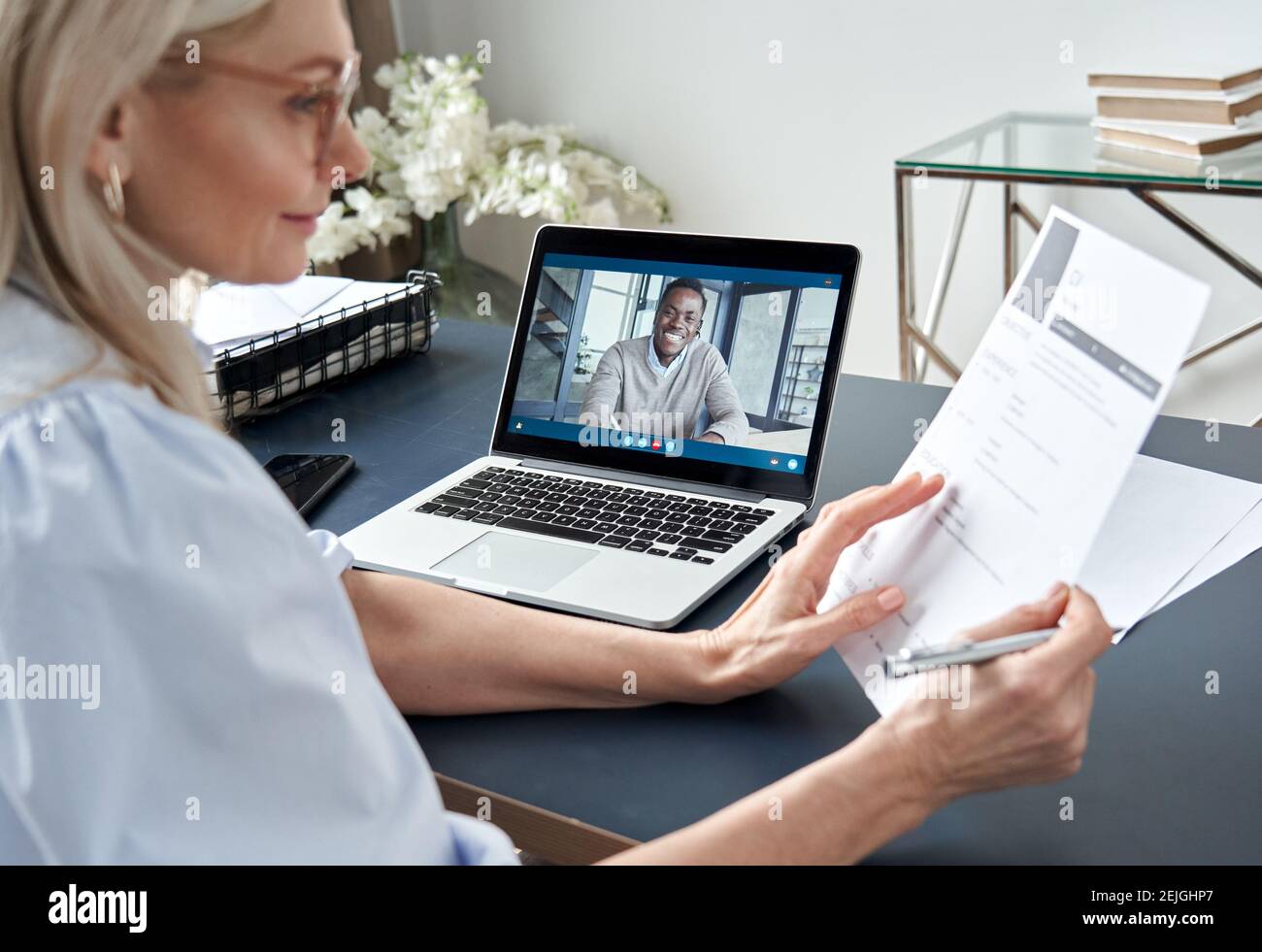 Female hr reading cv during online virtual job interview by video call ...