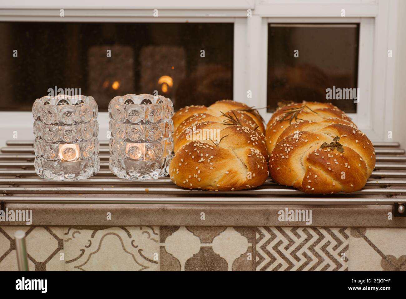 Shabbat image. Beautiful fresh challah bread and candles Stock Photo ...