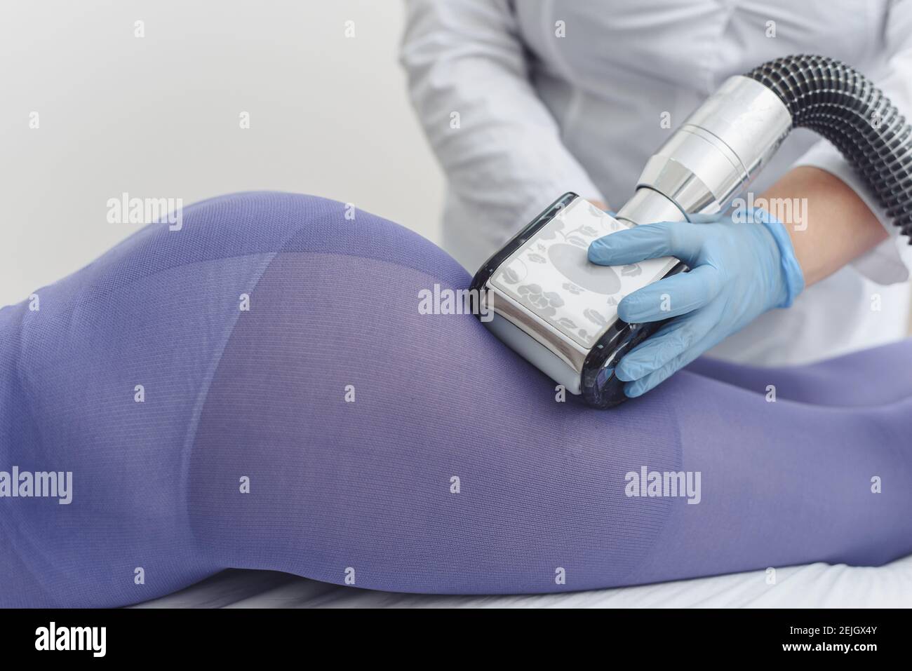 LPG, and body contouring treatment in clinic. Beautiful woman getting beauty therapy against ...