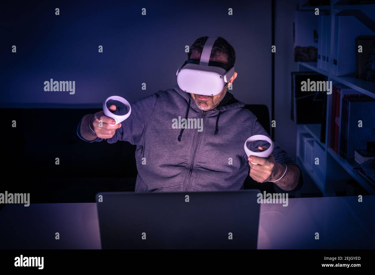 Man playing with virtual reality device. Cyberpunk futuristic mood ...