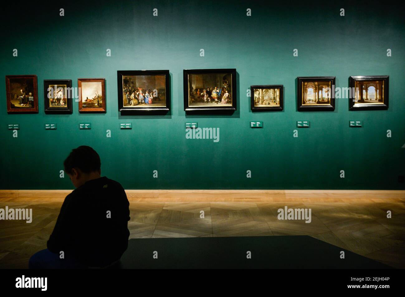 A visitor admires paintings at a recently opened Palace of the Princess ...