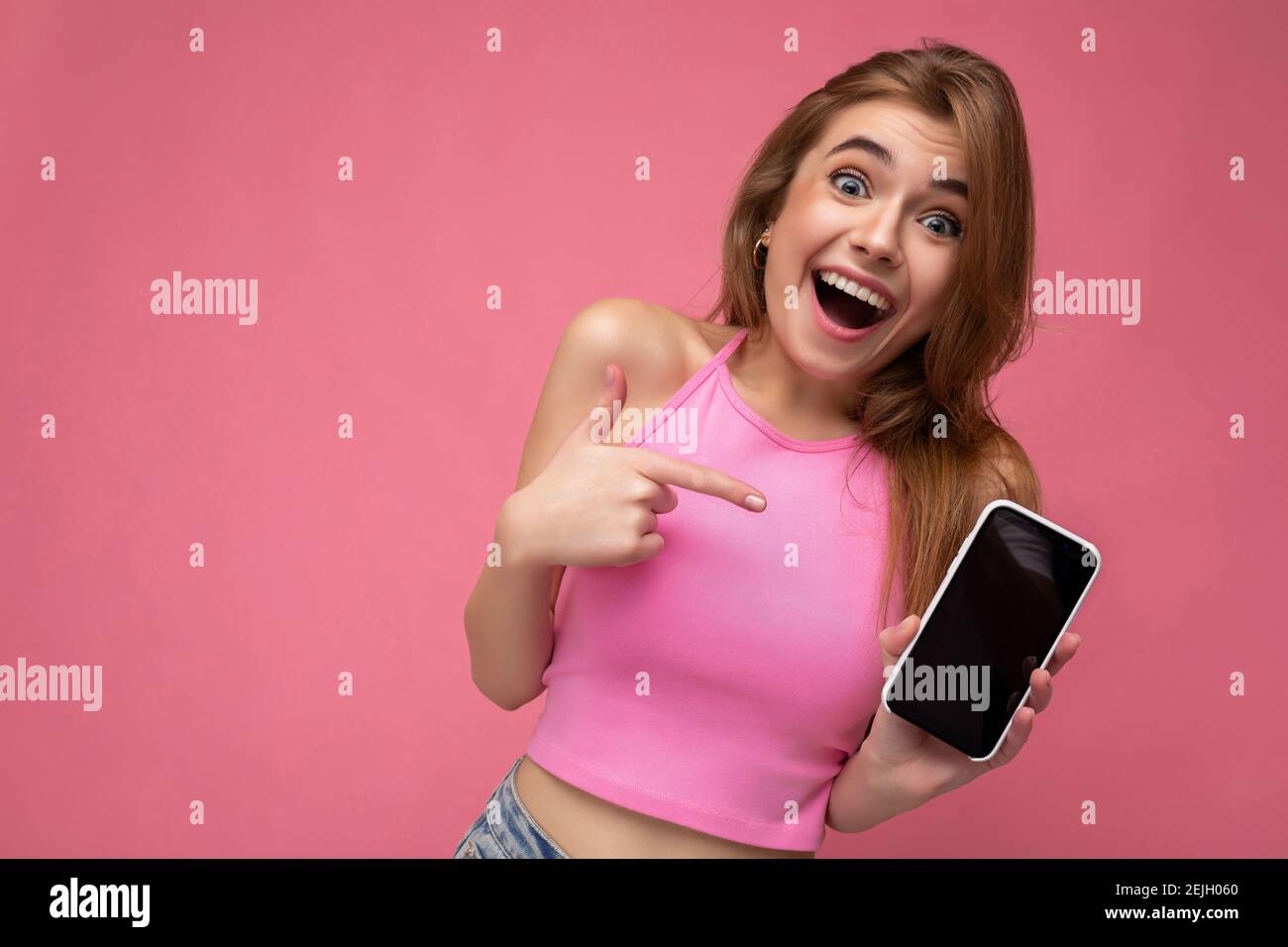 Photo of beautiful happy joyful young blonde woman wearing pink top ...