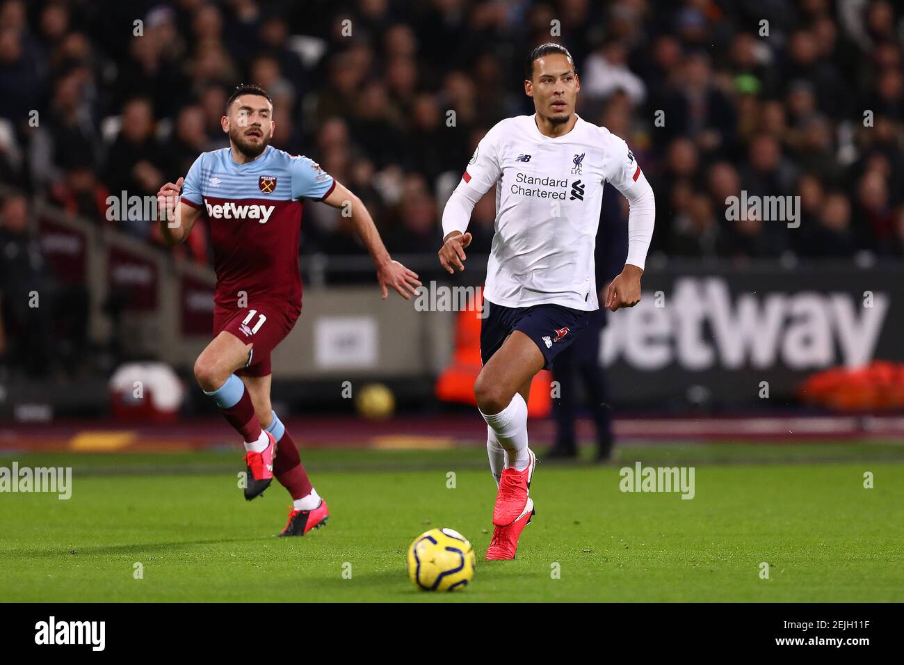 Virgil van Dijk of Liverpool and Robert Snodgrass of West Ham United in ...