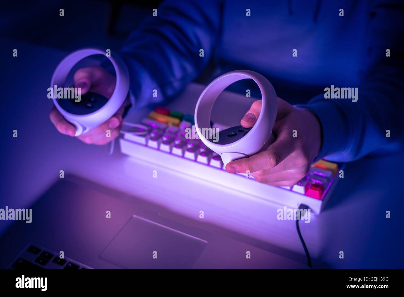 Closeup of young hands playing with virtual reality device. Cyberpunk ...