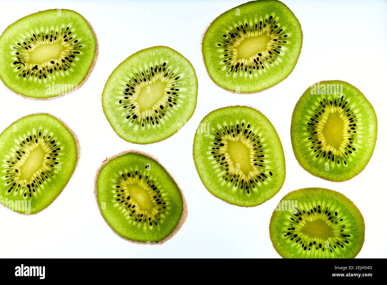Close up photo of kiwi on white background. Kiwi fruit cut in half with ...