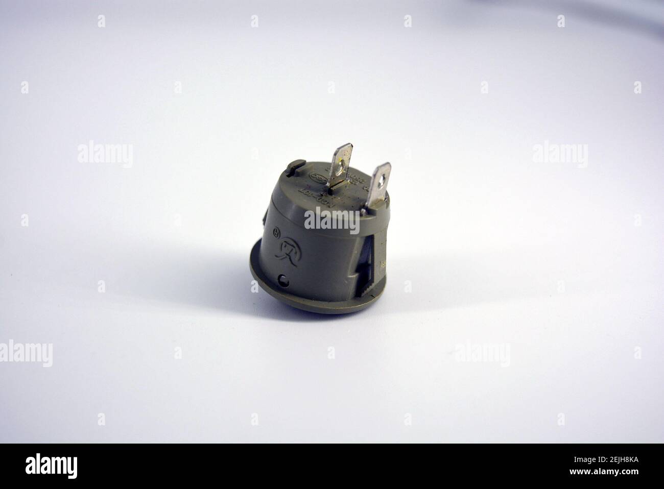 Gray metal button with contacts for switching and inclusion of 220V or ...