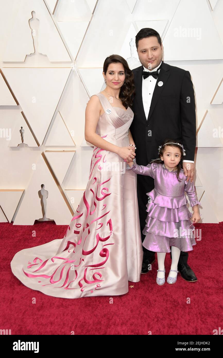 Waad Al-Kateab and Dr. Hamza al-Kateab walking on the red carpet at the ...