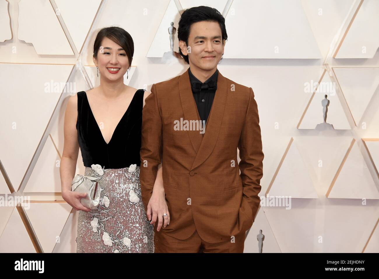 John Cho and his wife actress Kerri Higuchi walking on the red carpet ...