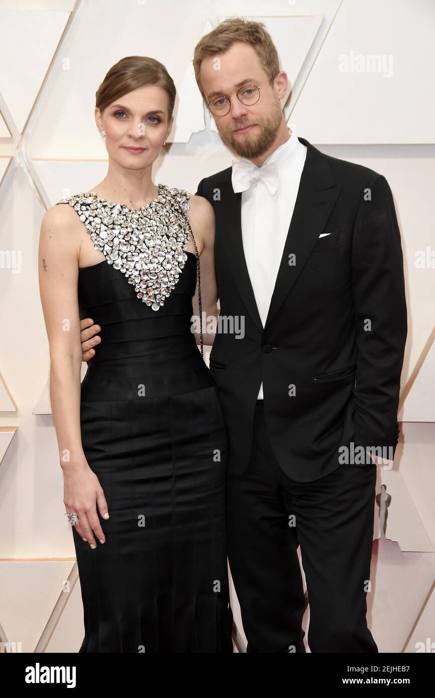 Hildur Gudnadottir and Sam Slater walking on the red carpet at the 92nd ...