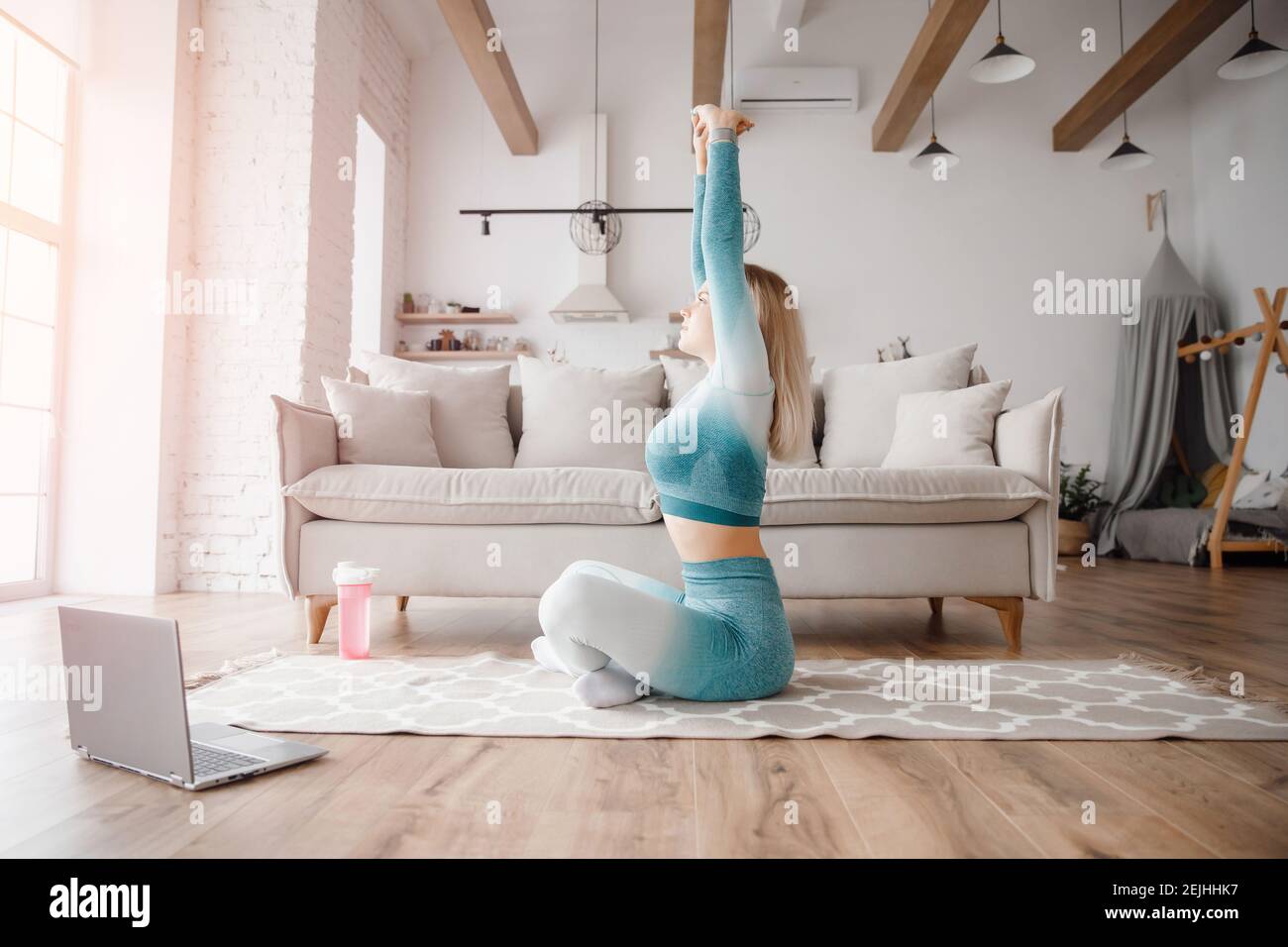 Blog influencer woman recording sport video working on laptop computer ...