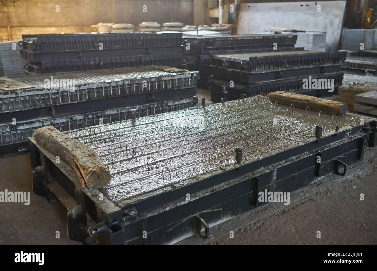 Manufacturing concrete slabs. reinforced concrete production. Workers ...