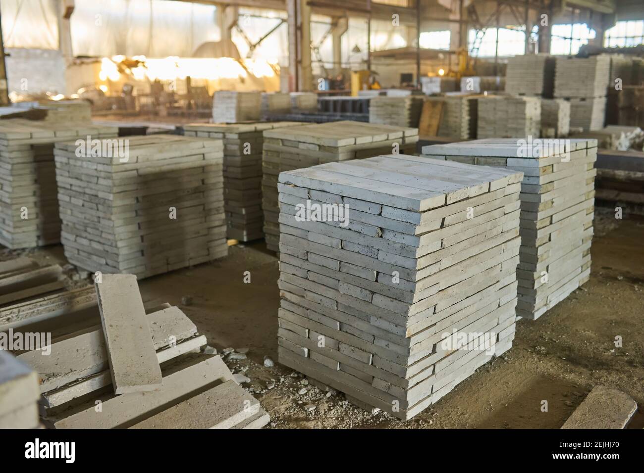 Paving slabs factory. Tiles piled in pallets. Warehouse paving slabs in ...