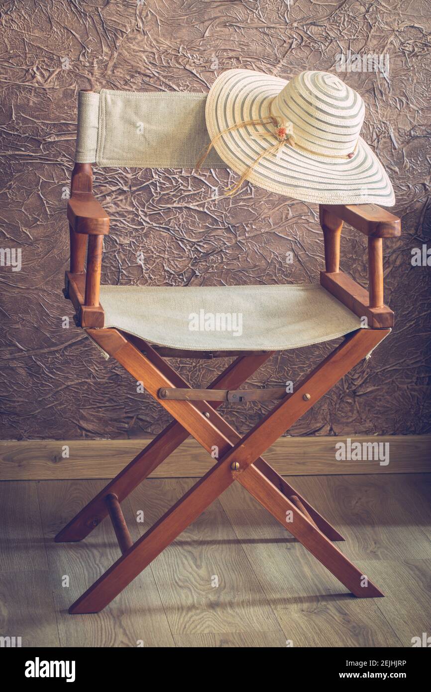 Hat hanging on chair hi-res stock photography and images - Alamy