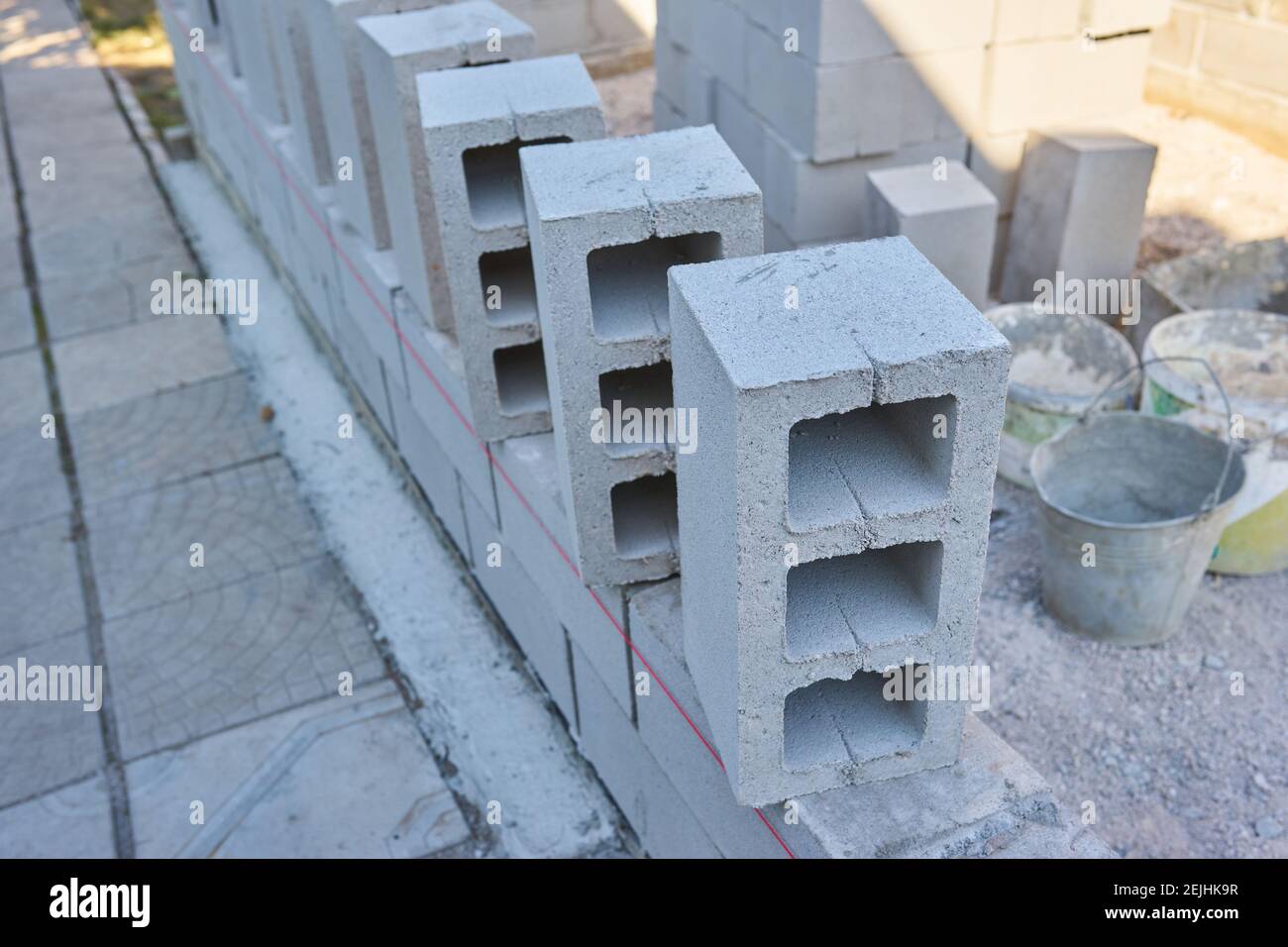 a worker builds a cinder block wall for a new home Stock Photo - Alamy
