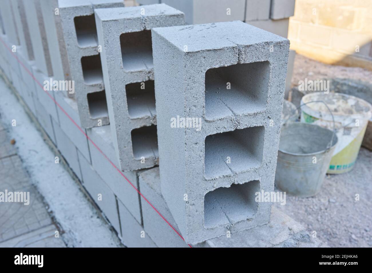 a worker builds a cinder block wall for a new home Stock Photo - Alamy
