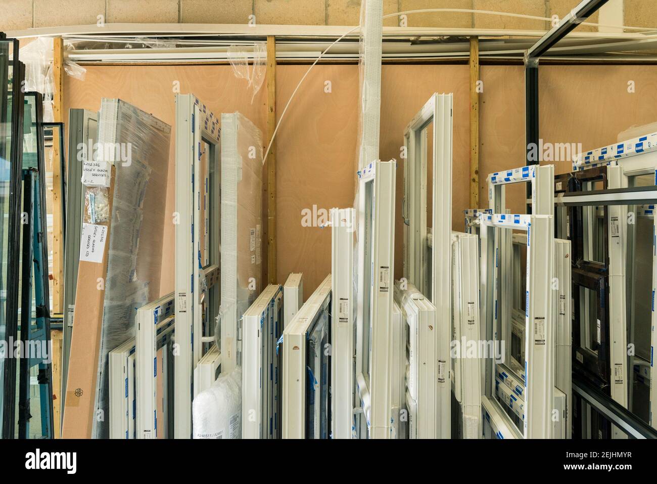 A double glazing business store room, show room with lots of plastic ...