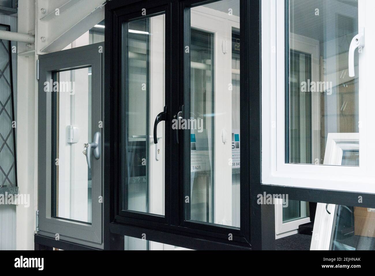 A double glazing business store room, show room with lots of plastic ...