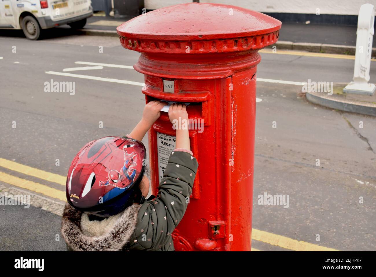 Child posting a letter Stock Photo - Alamy