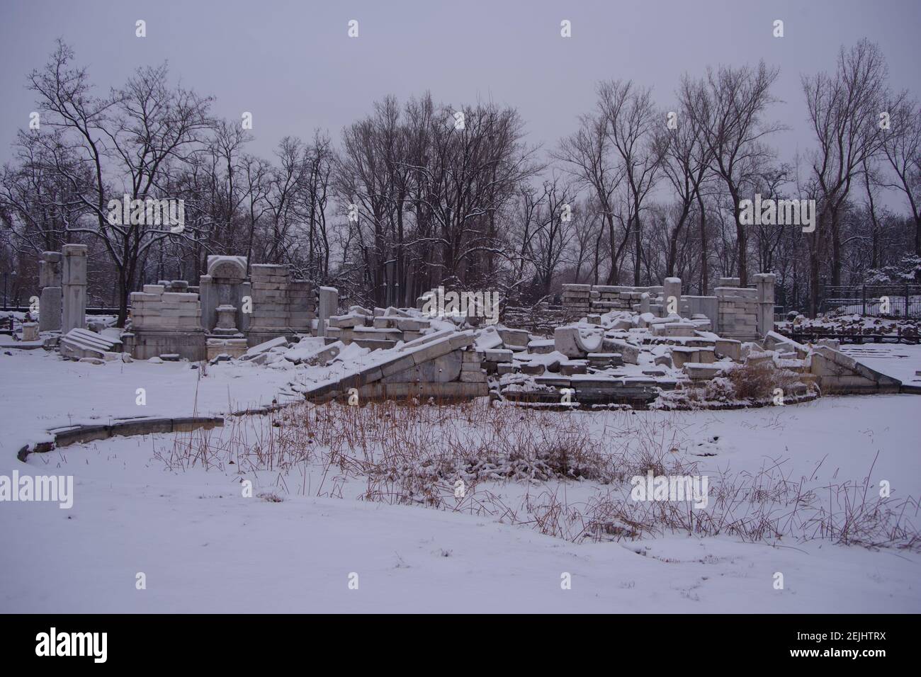 The snow covers debris of the Old Summer Palace, known in Chinese as ...